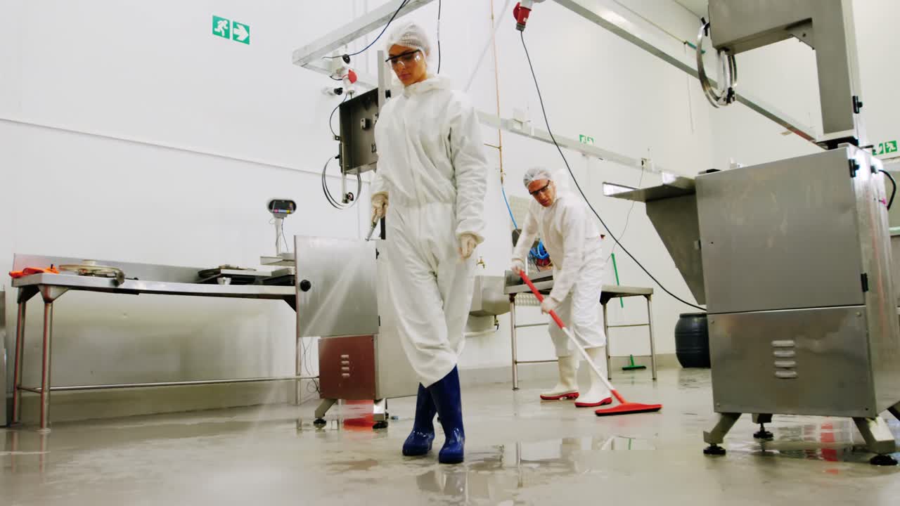 Butchers cleaning floor | Premium Stock Video Footage