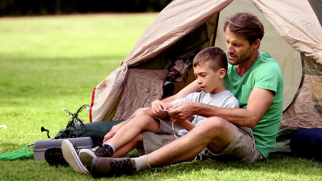 Father Explaining How A Compass Works To His Son Free Stock Video ...