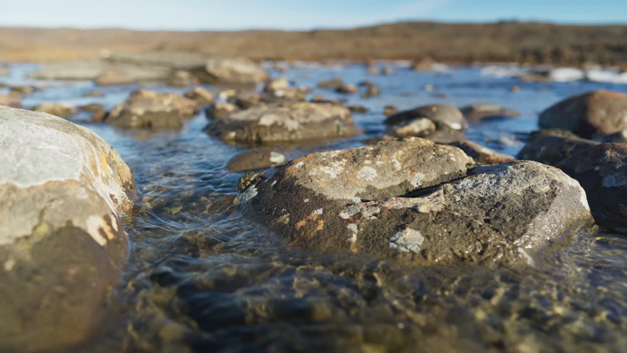 End of summer river running through rocks Premium Stock Video Footage