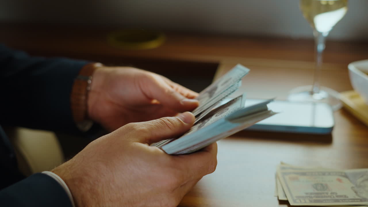Hands counting stacks of money | Premium Stock Video Footage