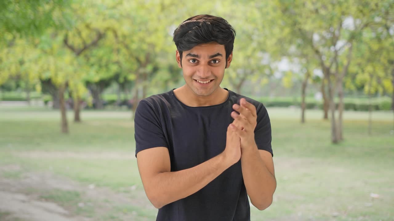 Happy Indian Man Clapping And Appreciating At A Park Free Stock Video ...