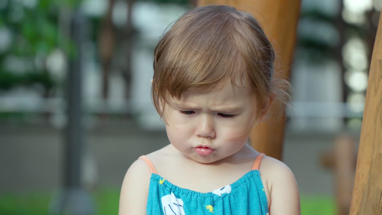 Premium stock video - Sad blonde girl looking down with a runny nose at ...