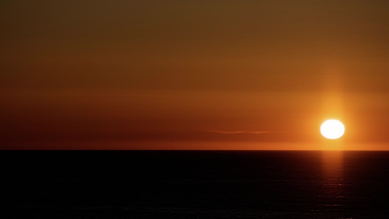 The midnight sun in its early stage. close up time lapse. the sun moves ...
