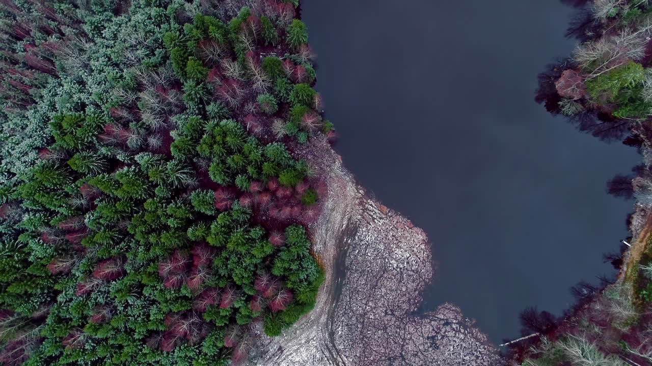 Aerial Bird's Eye View Over Autumn Forest Landscape Surrounding A Lake ...