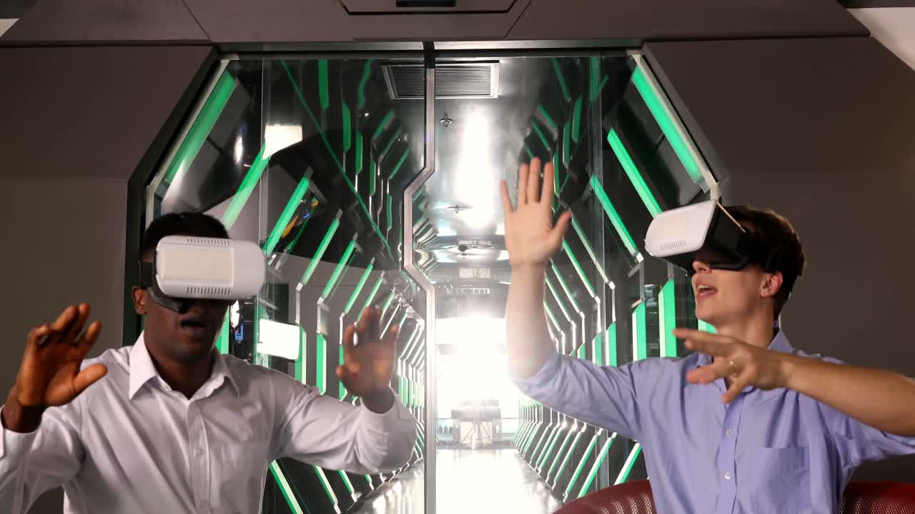 Premium stock video - Male executives using virtual reality headset 4k