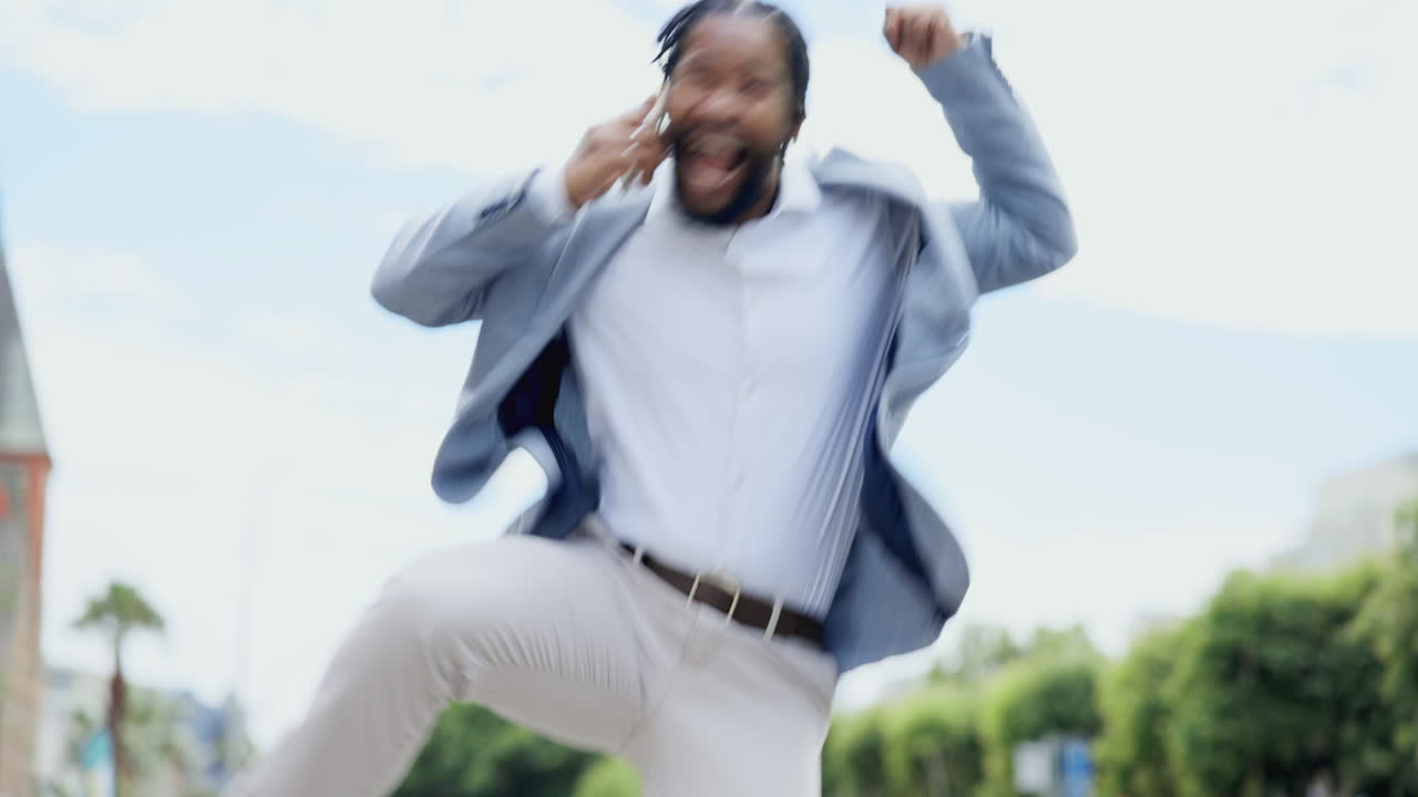 Premium stock video - Jumping, success and phone call for business man