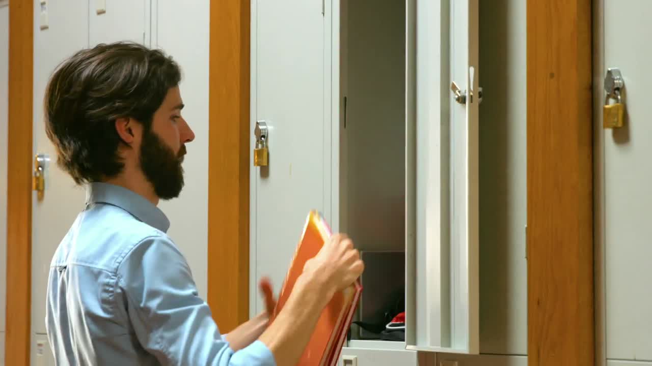 Premium stock video - Student going to his locker