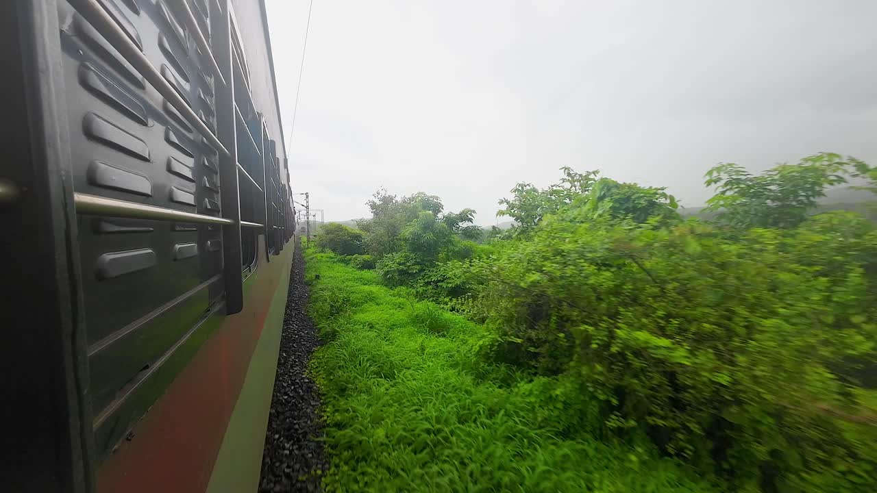 Train goes in the rain in forest in Konkan railway | Premium Stock ...