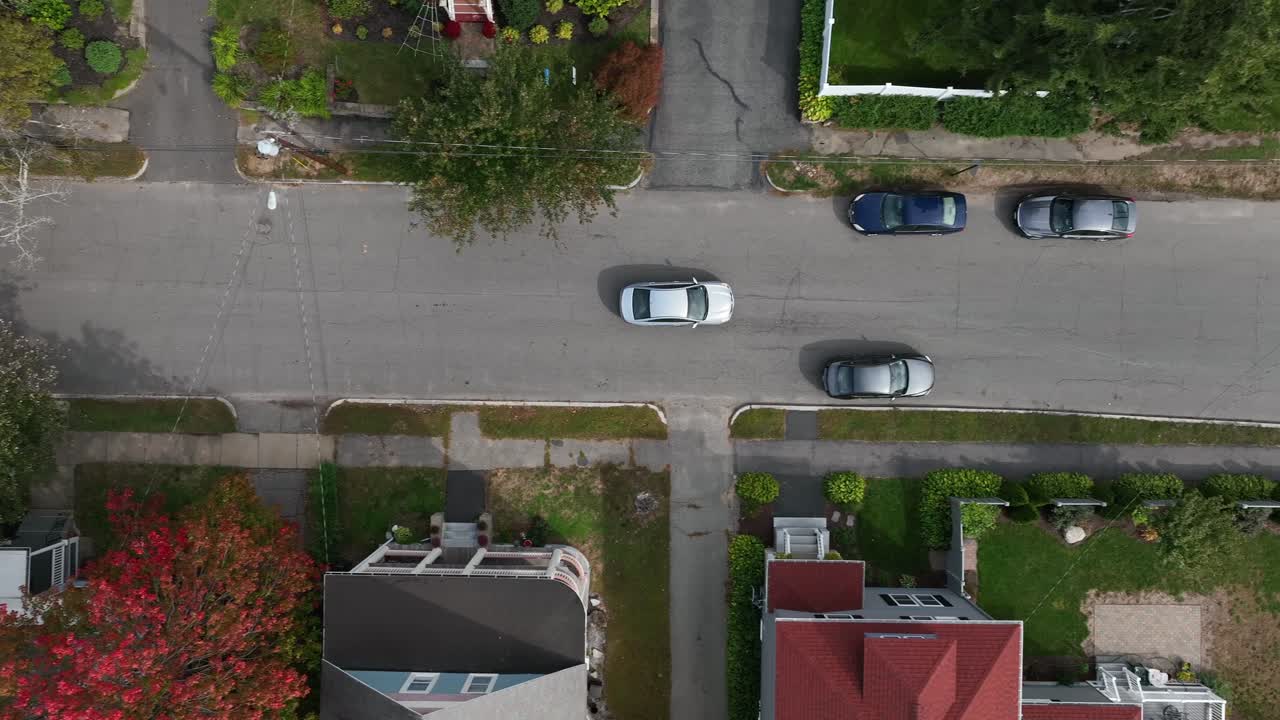 Premium stock video - Straight down drove videography of silver sedan ...