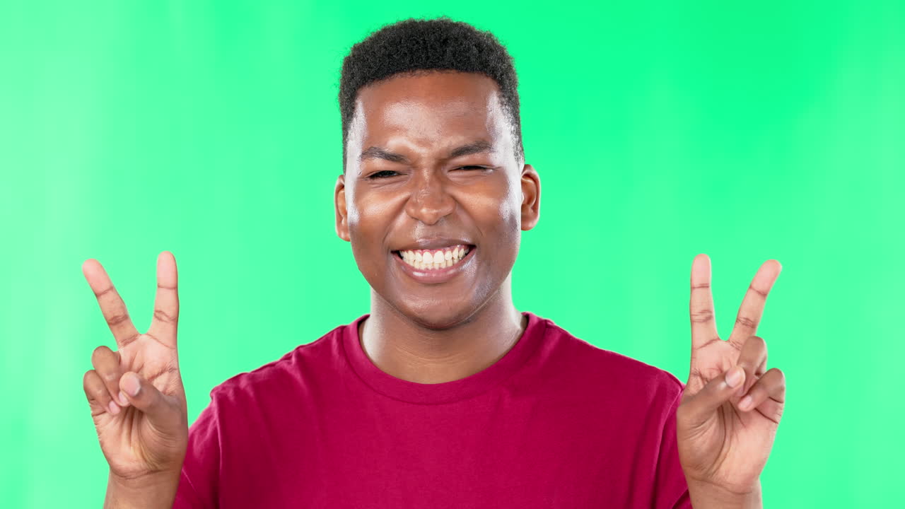 Premium stock video - Peace, green screen and face of man in studio