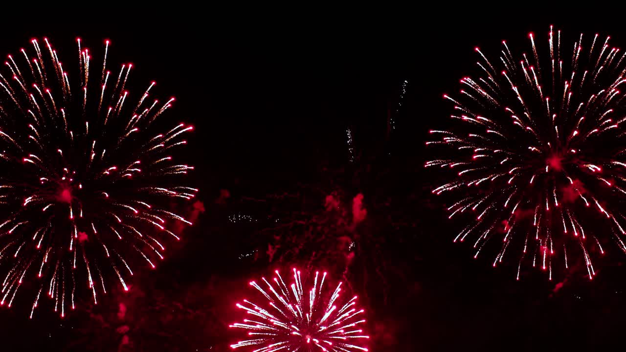 Premium stock video - Colorful fireworks exploding in the night sky ...