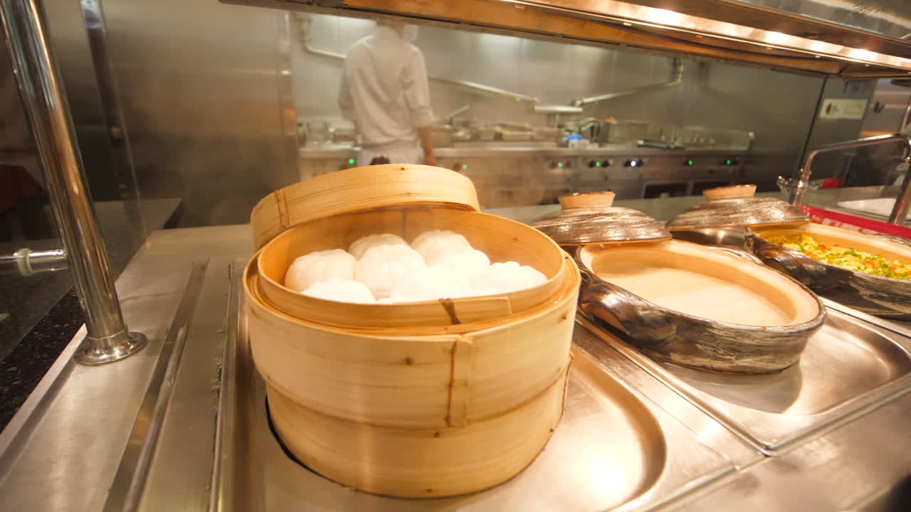 Premium stock video - Steam bamboo steamer rice ball idli