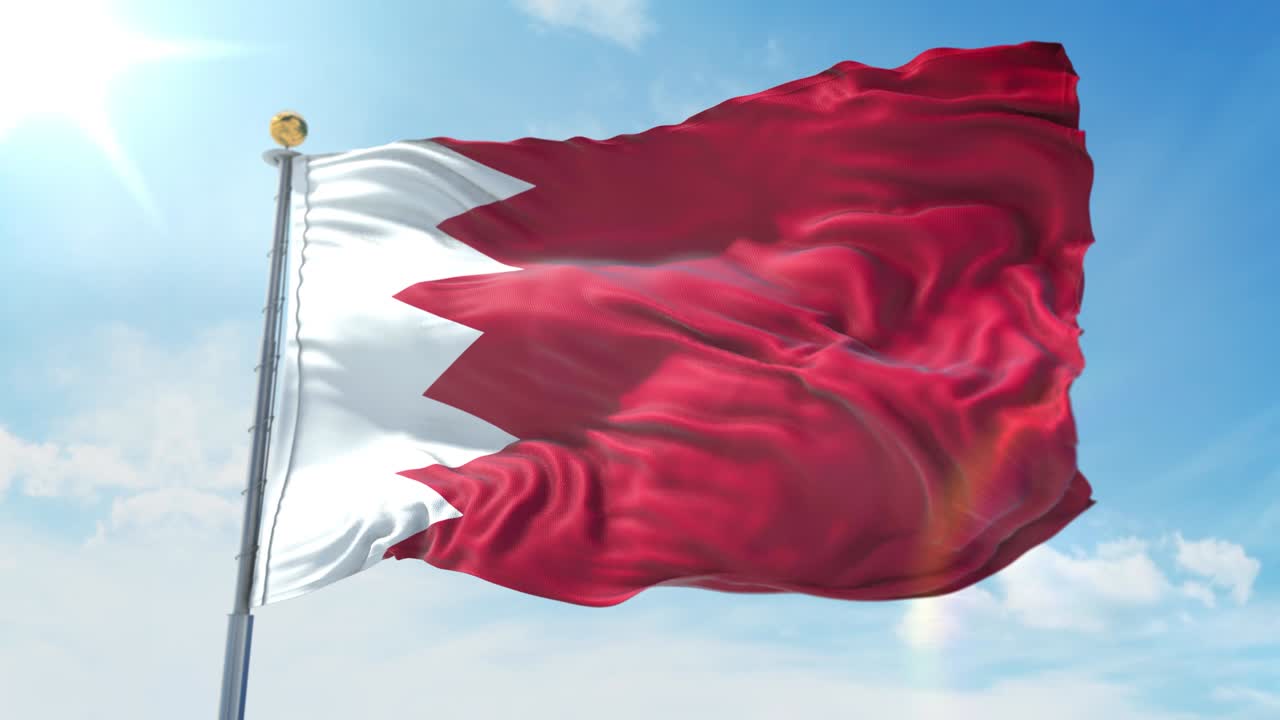 Bahrain flag waving in the wind against deep blue sky. National theme ...