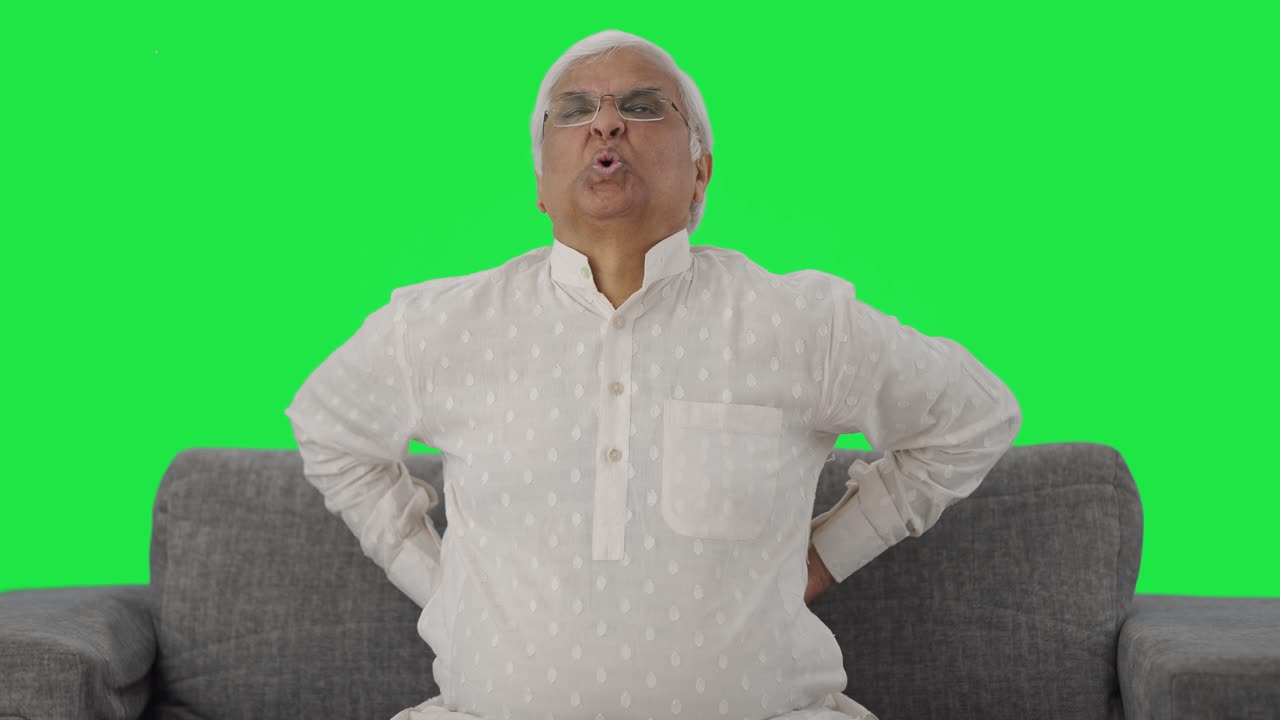 Sick indian old man suffering from back pain green screen Premium Stock ...