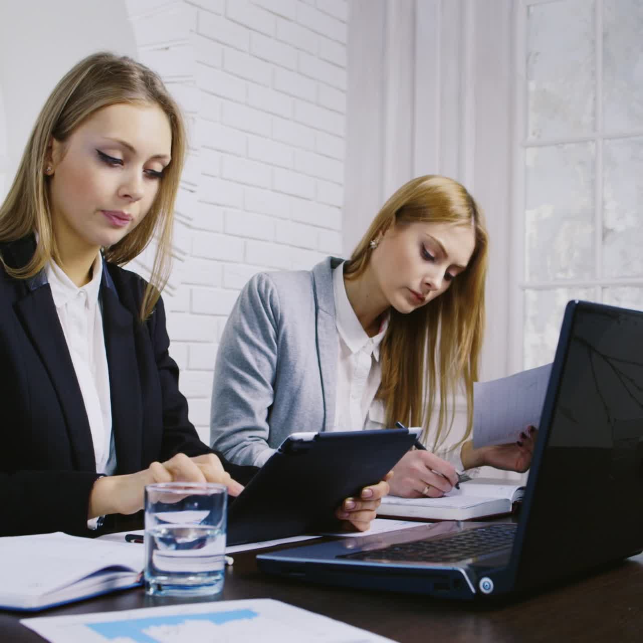 Premium stock video - Women using technology in an office