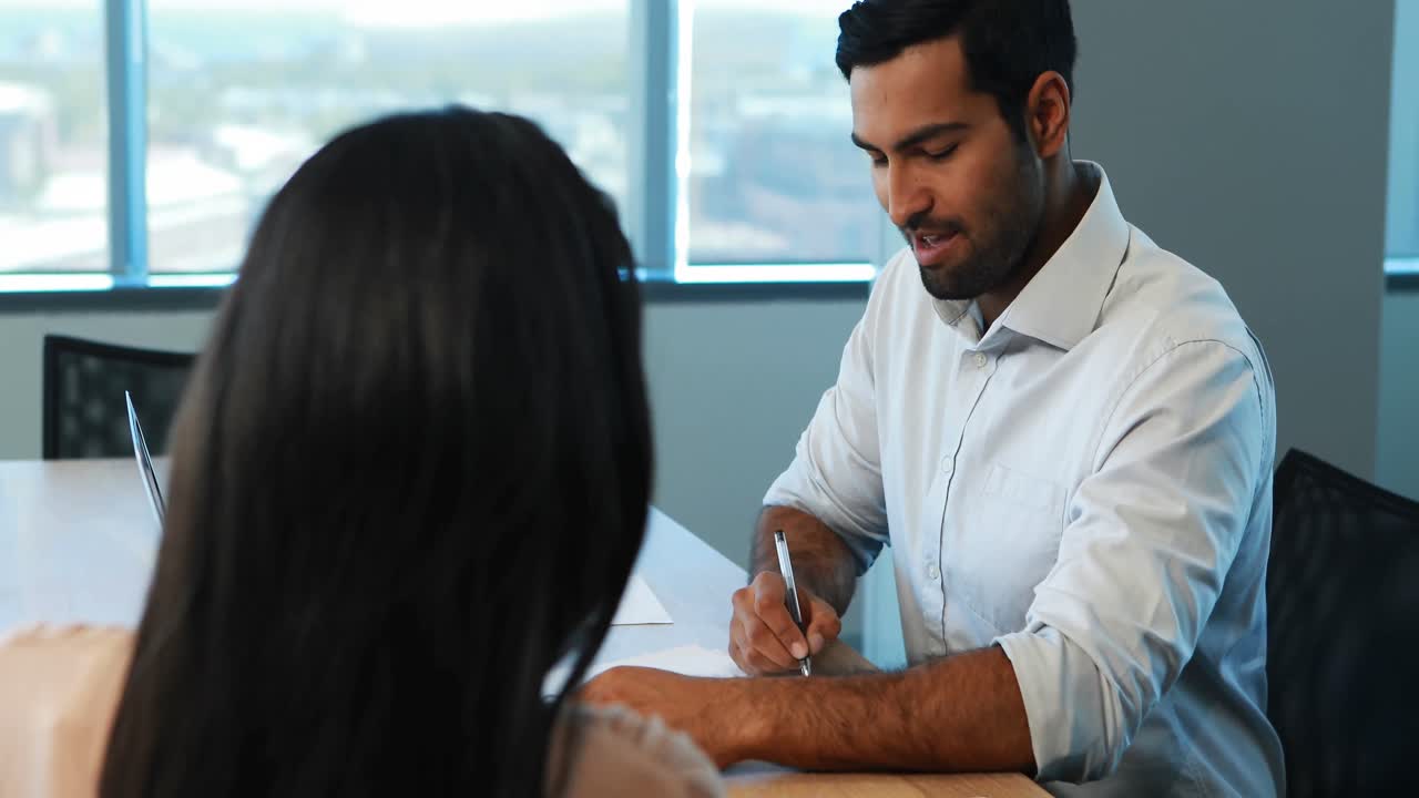 Premium stock video - Recruiter taking interview of female candidate
