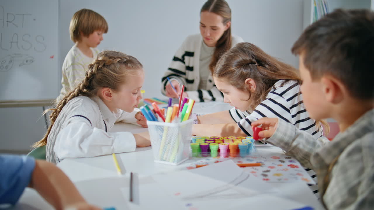 Talented kids creating artwork together in studio closeup. Active ...