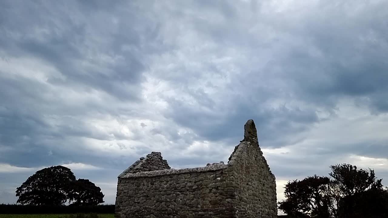 The ruins of capel lligwy on rural moelfre countryside, anglesey, north ...