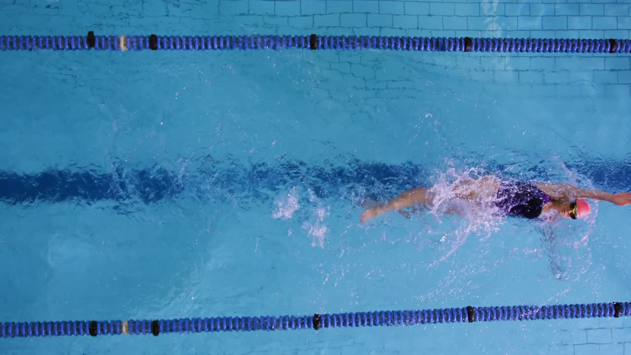 Premium stock video - Swimmer training in a swimming pool