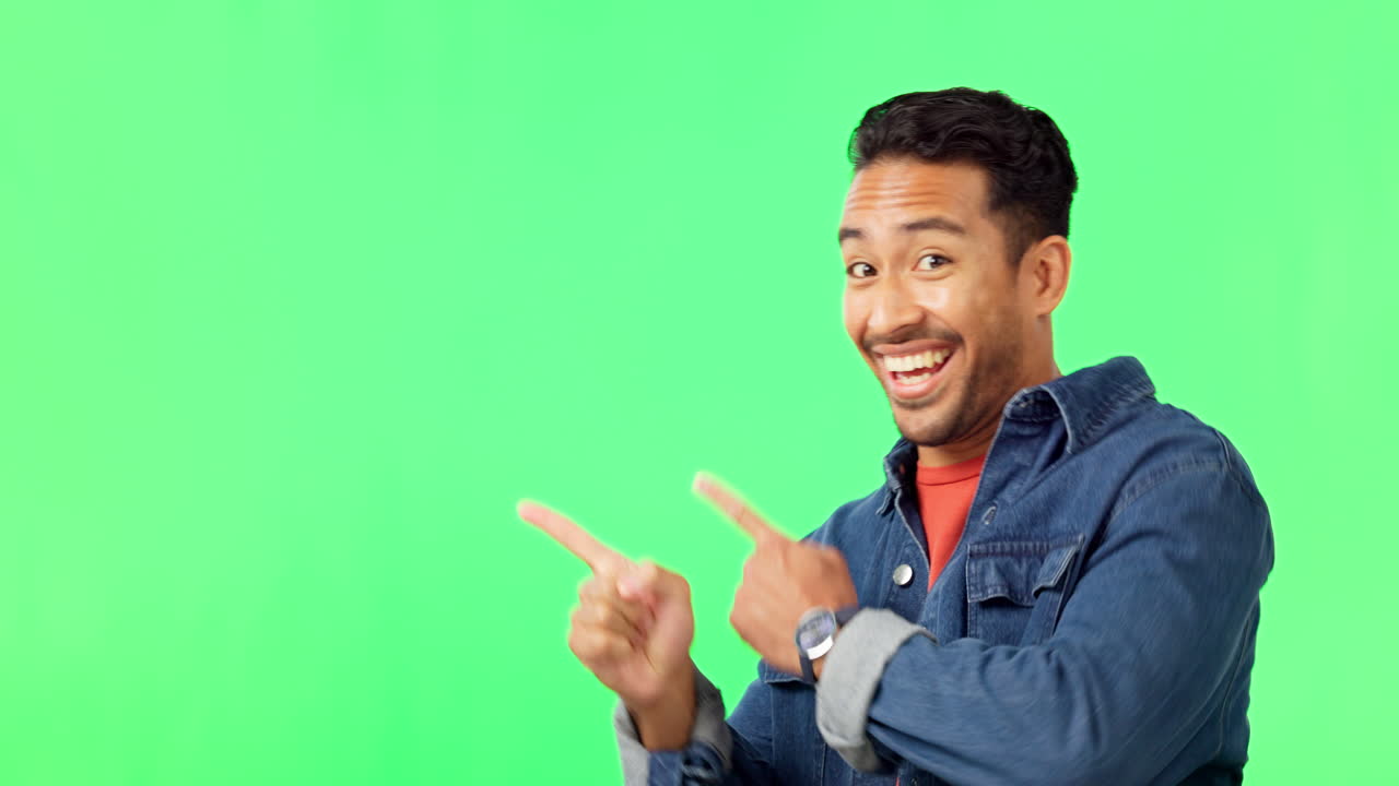 Premium stock video - Asian man, pointing and dancing on green screen