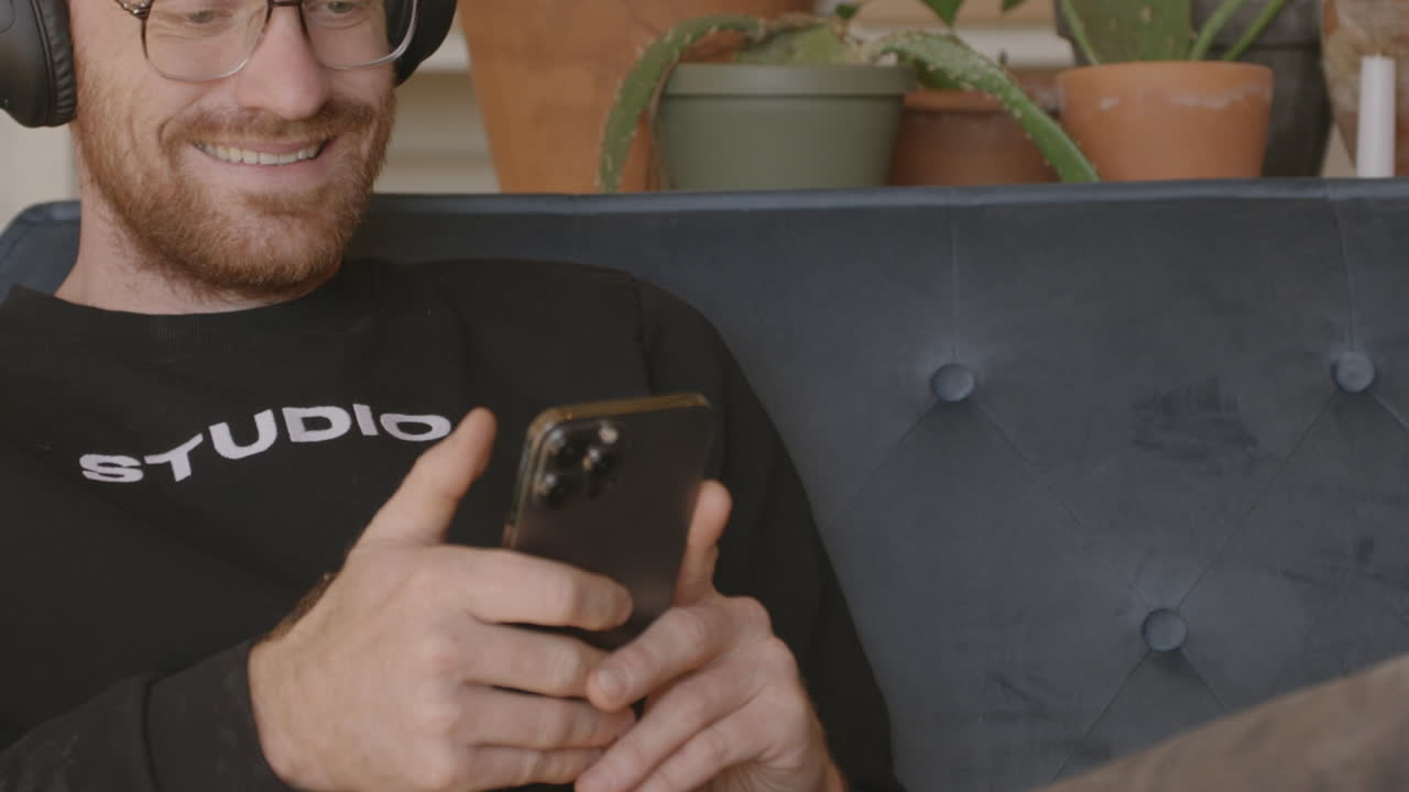 Premium stock video - Medium close front angle of a man sitting on a ...