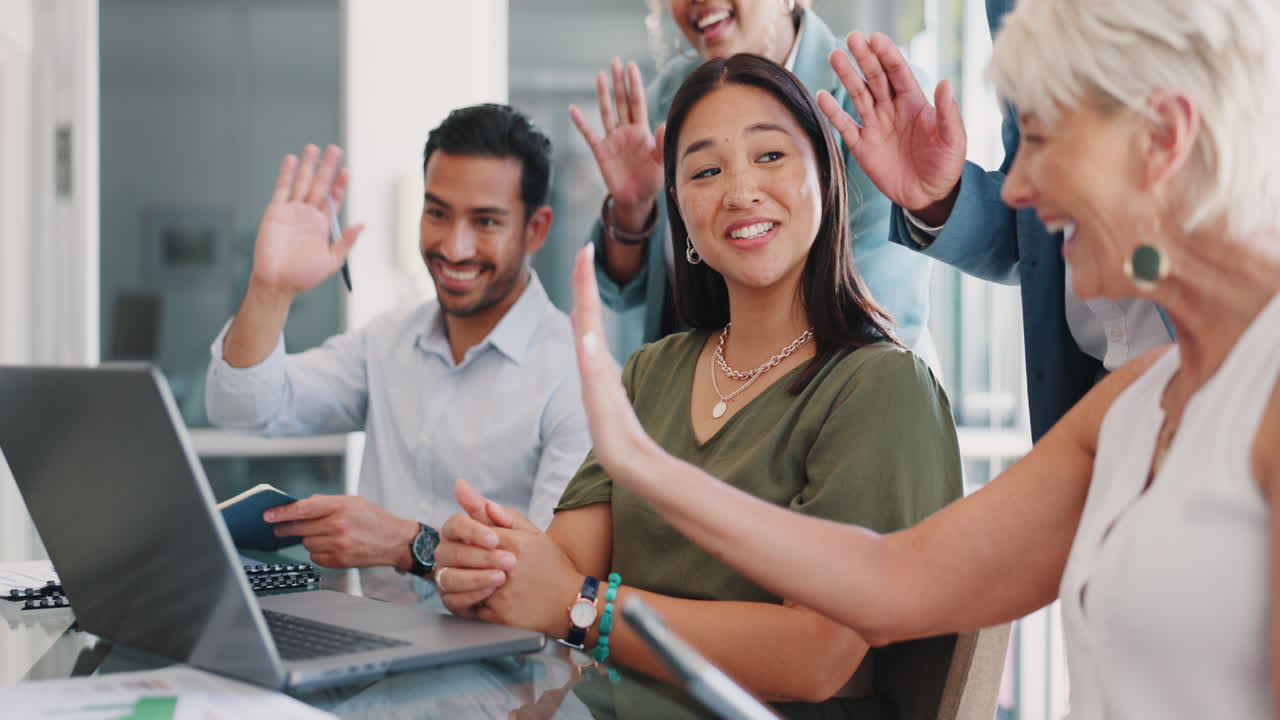 Business people wave hello on laptop Premium Stock Video Footage