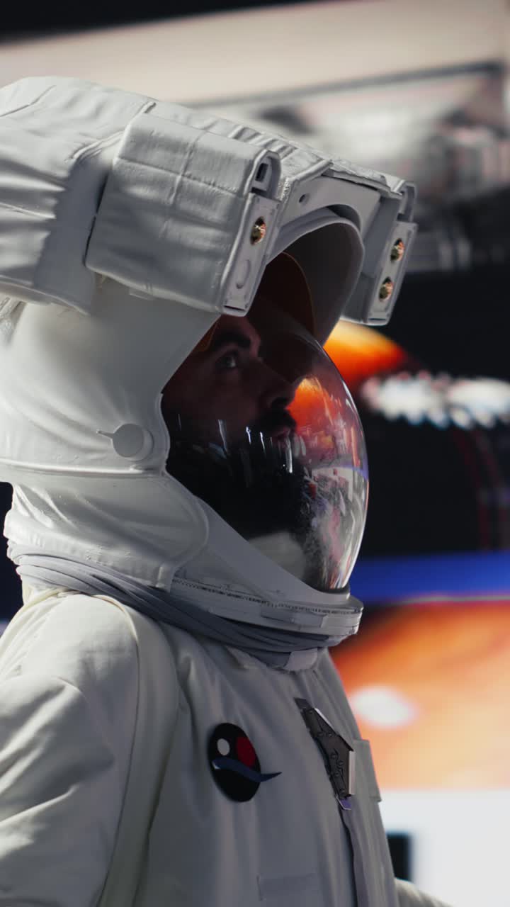 Vertical video space man on a deep space mission surrounded by stars ...