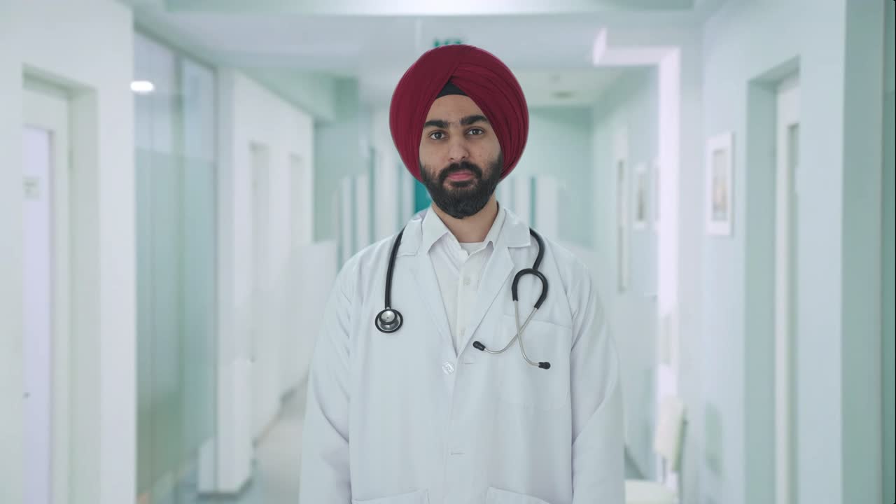 Premium stock video - Serious sikh indian doctor looking