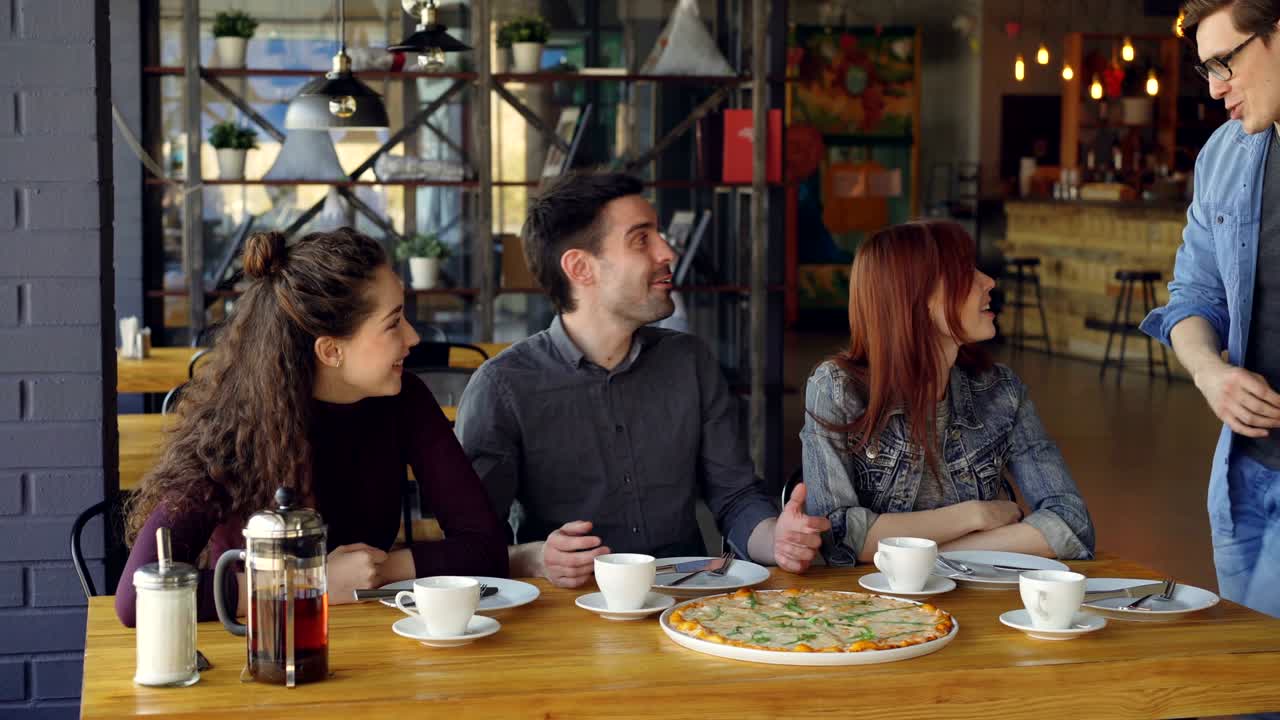 Handsome young guy in casual denim clothes is meeting his friends in ...