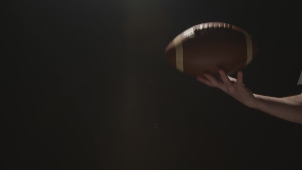 Free stock video - Close up studio shot of american football player ...