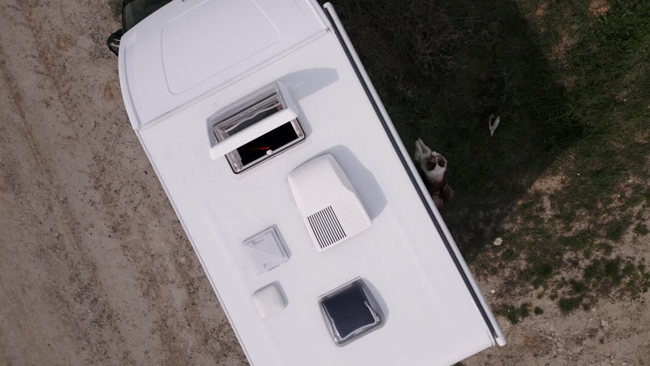 Premium stock video - A person places a foldable portable solar panel ...