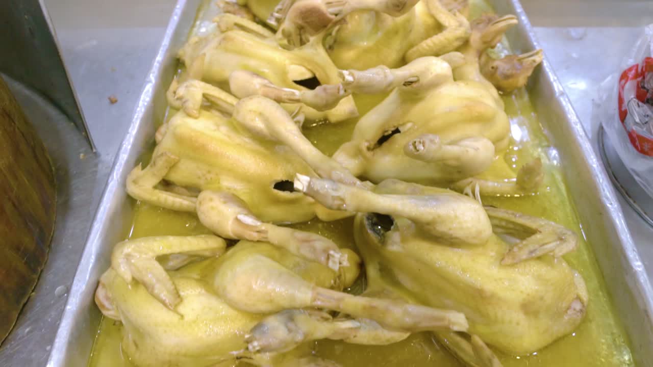 Premium stock video - Raw chicken meat on display in chinese open ...