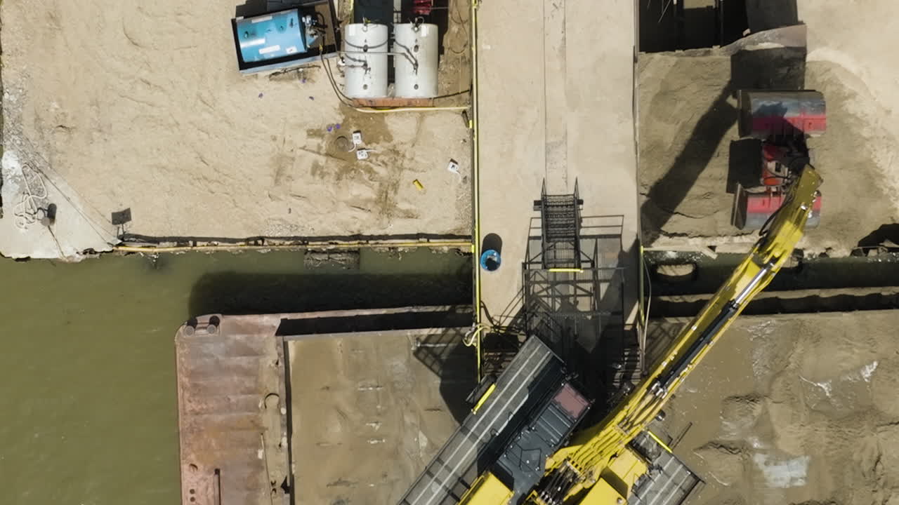 Clamshell Bucket Machinery Unloading Sand From Barge At The Sand And ...