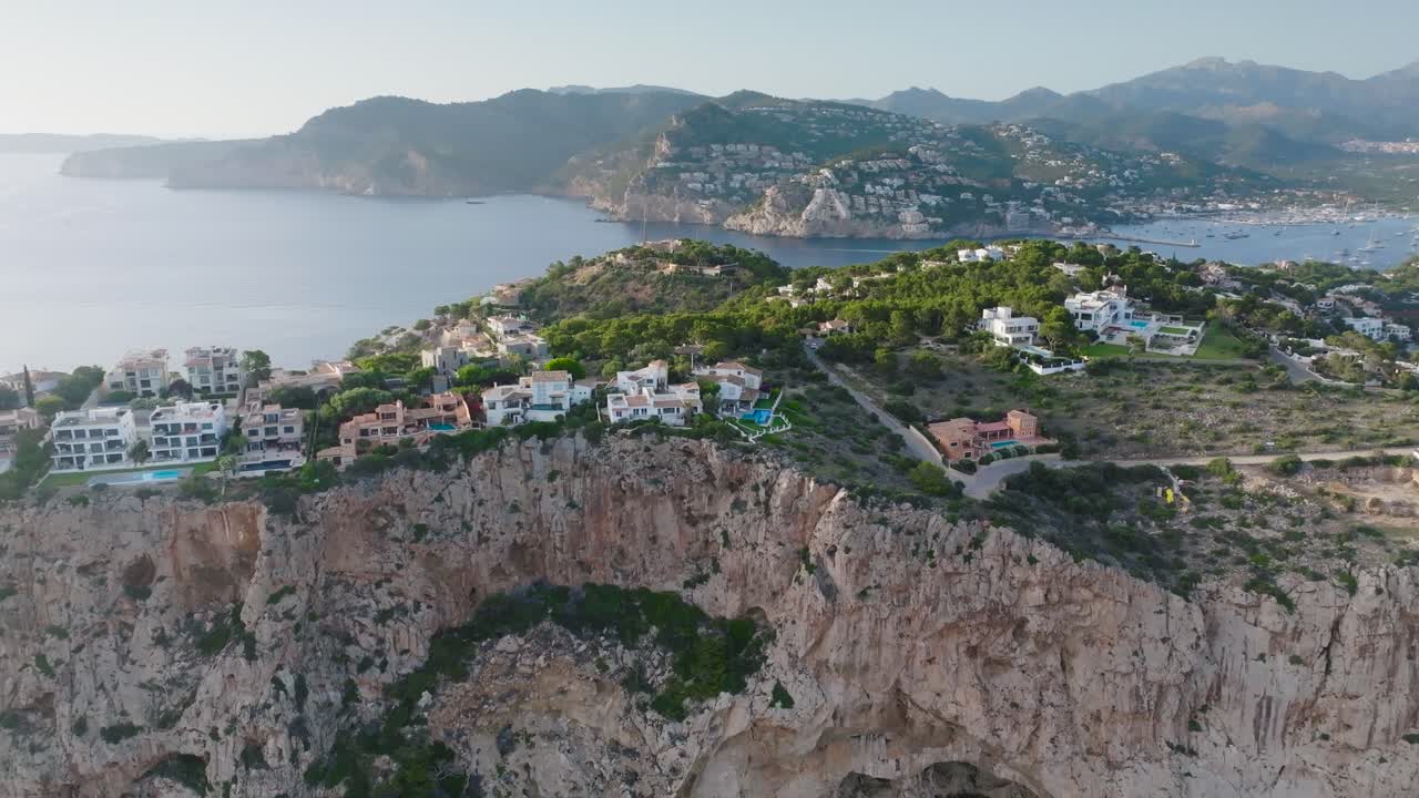 Aerial Approach Toward Rugged Seaside Cliff With Buildings, Mallorca ...