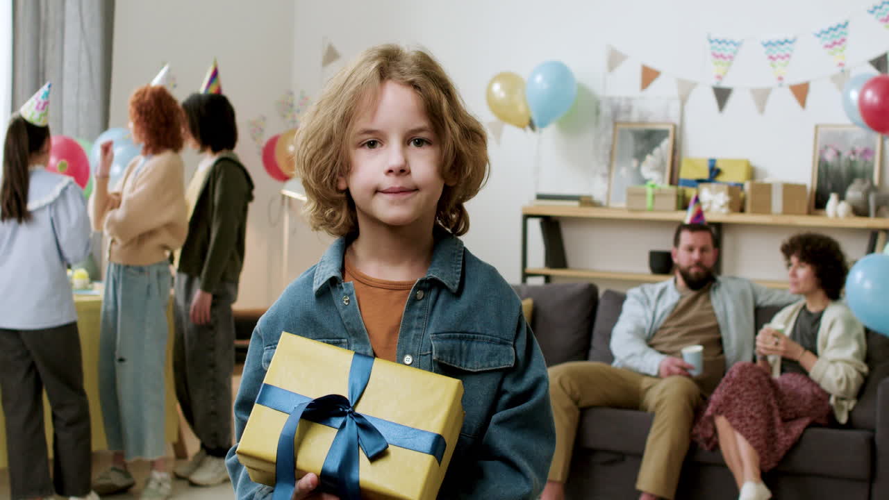 Free stock video - Birthday boy with birthday present