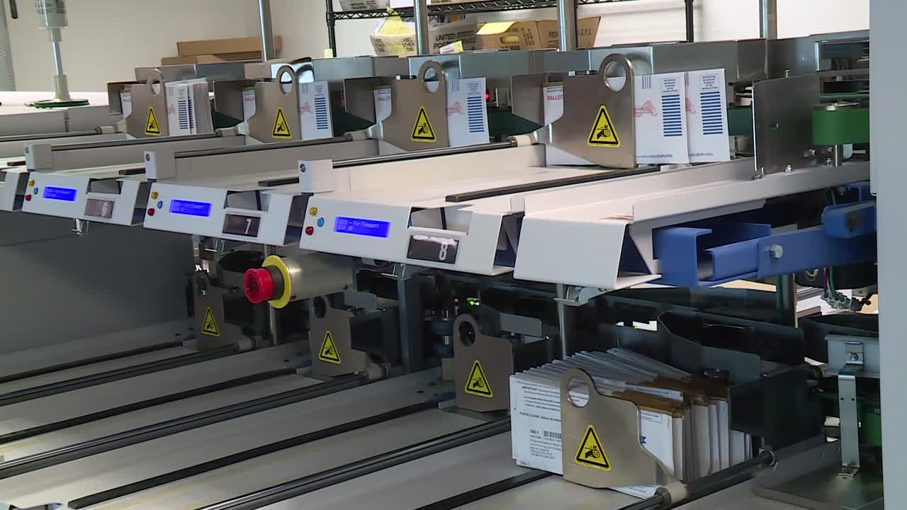 Premium stock video - Automatic ballot counting machine sorting votes