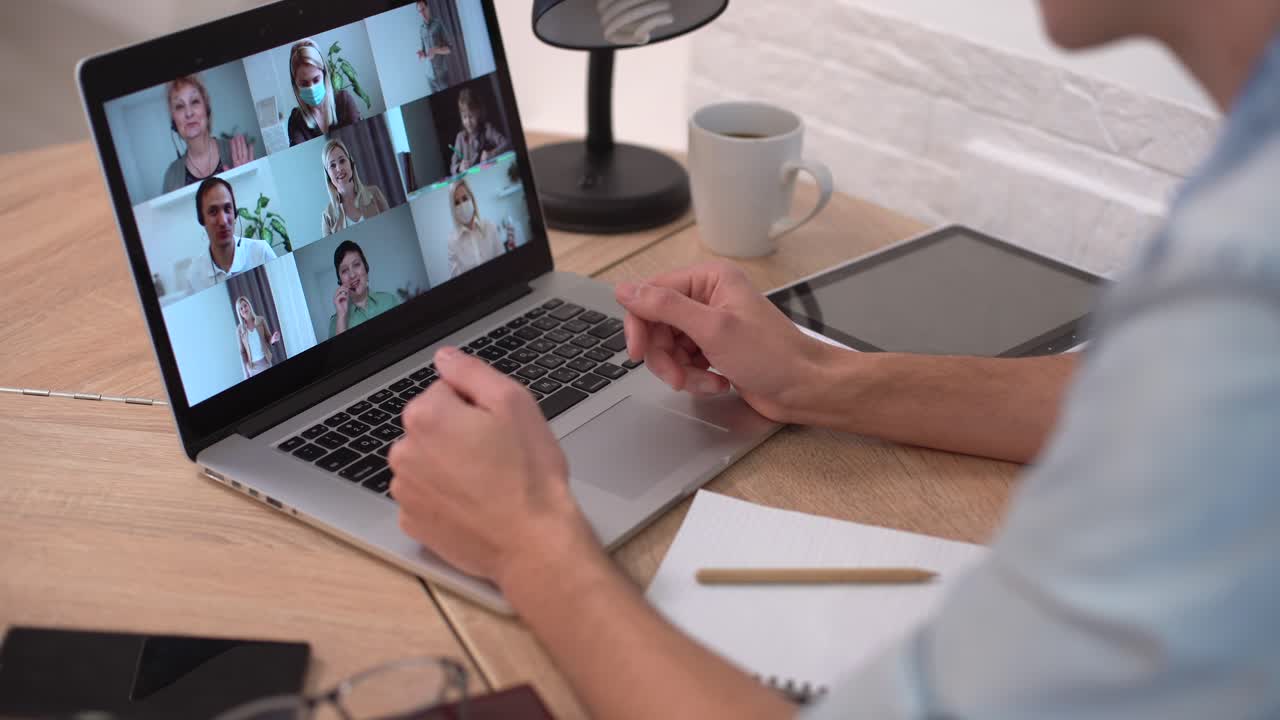 Businessman making video call, discussing strategy with partners online ...