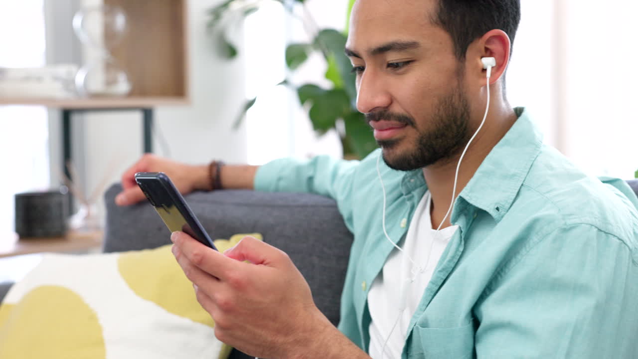 Premium stock video - Man on a phone watching a video on social media