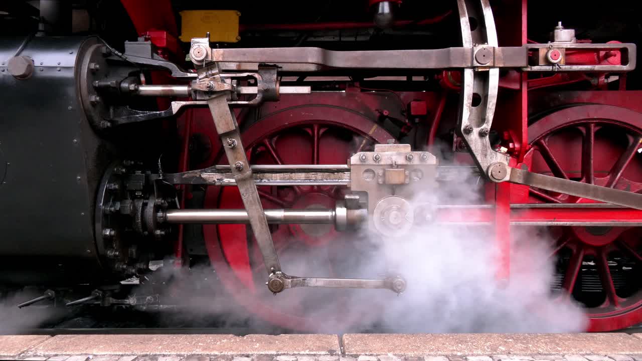 Premium stock video - Wheels and valves in a steam locomotive