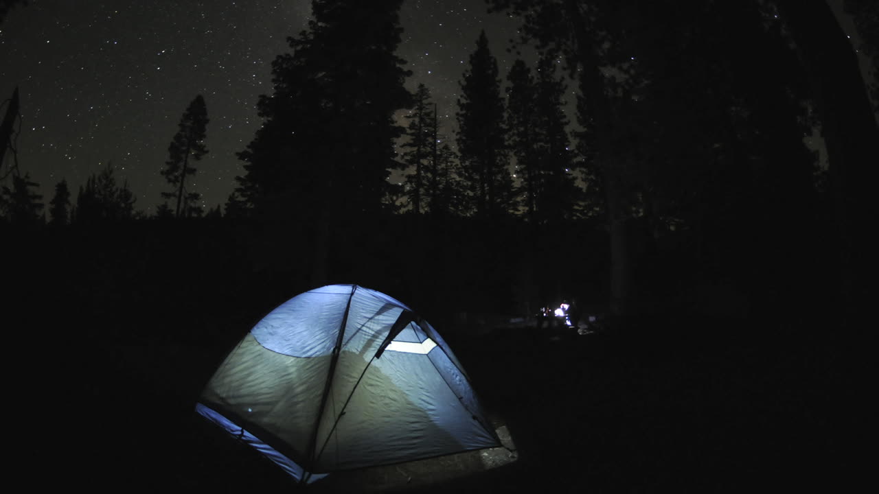 Premium stock video - Motion night dolly time lapse of a light tent ...