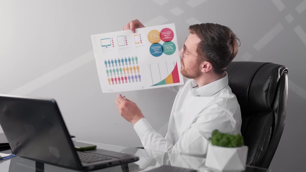 Premium stock video - Man in shirt showing graphs and presentation strategy