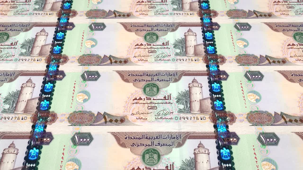 Banknotes of one thousand dirhams arabs rolling on screen, cash money ...