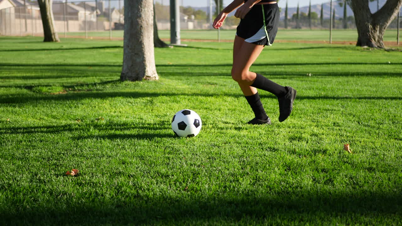 Premium stock video - A female womens soccer player running and ...