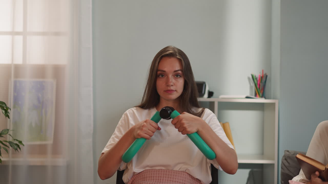 Disabled woman with muscular dystrophy does arm exercise | Premium ...