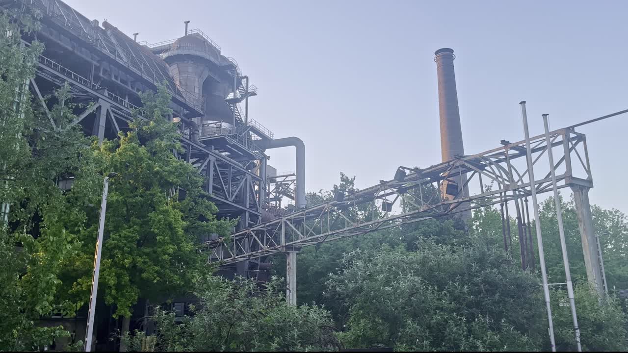 Metalwork With Steel Struts And Large Brick Chimney Overgrown In Nature ...