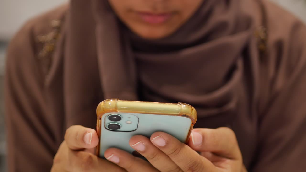 Premium stock video - Close up of women hand holding smart phone