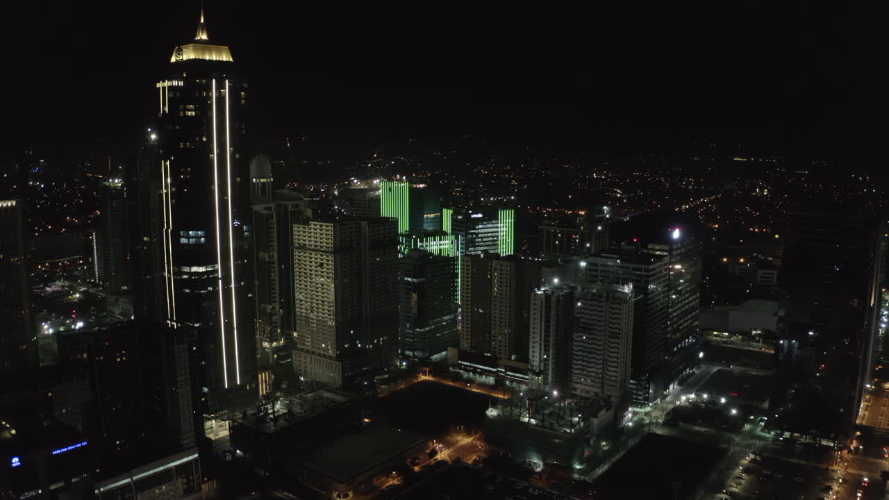 Premium stock video - Nighttime aerial cityscape flying through ...