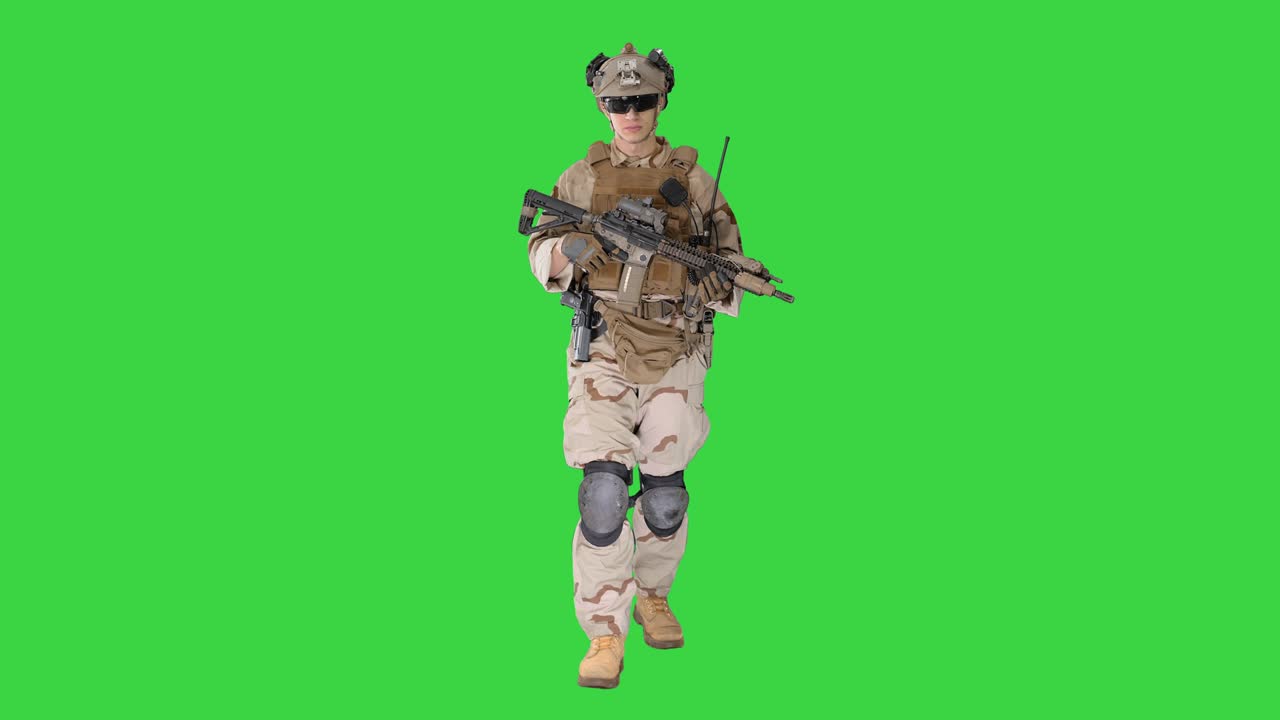 US Army soldier in combat uniform walking on a Green Screen, Chroma Key ...