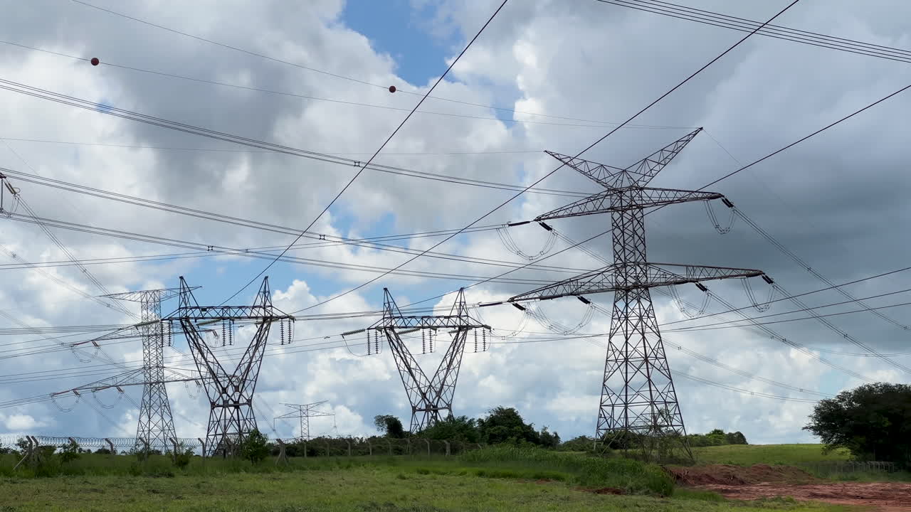 Premium stock video - Towers of power transmission lines in substation