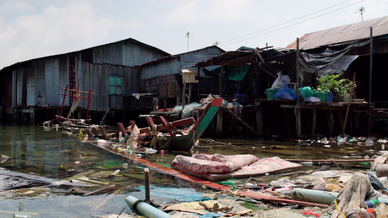 Premium stock video - Plastic derbis pollution in a floating village in ...